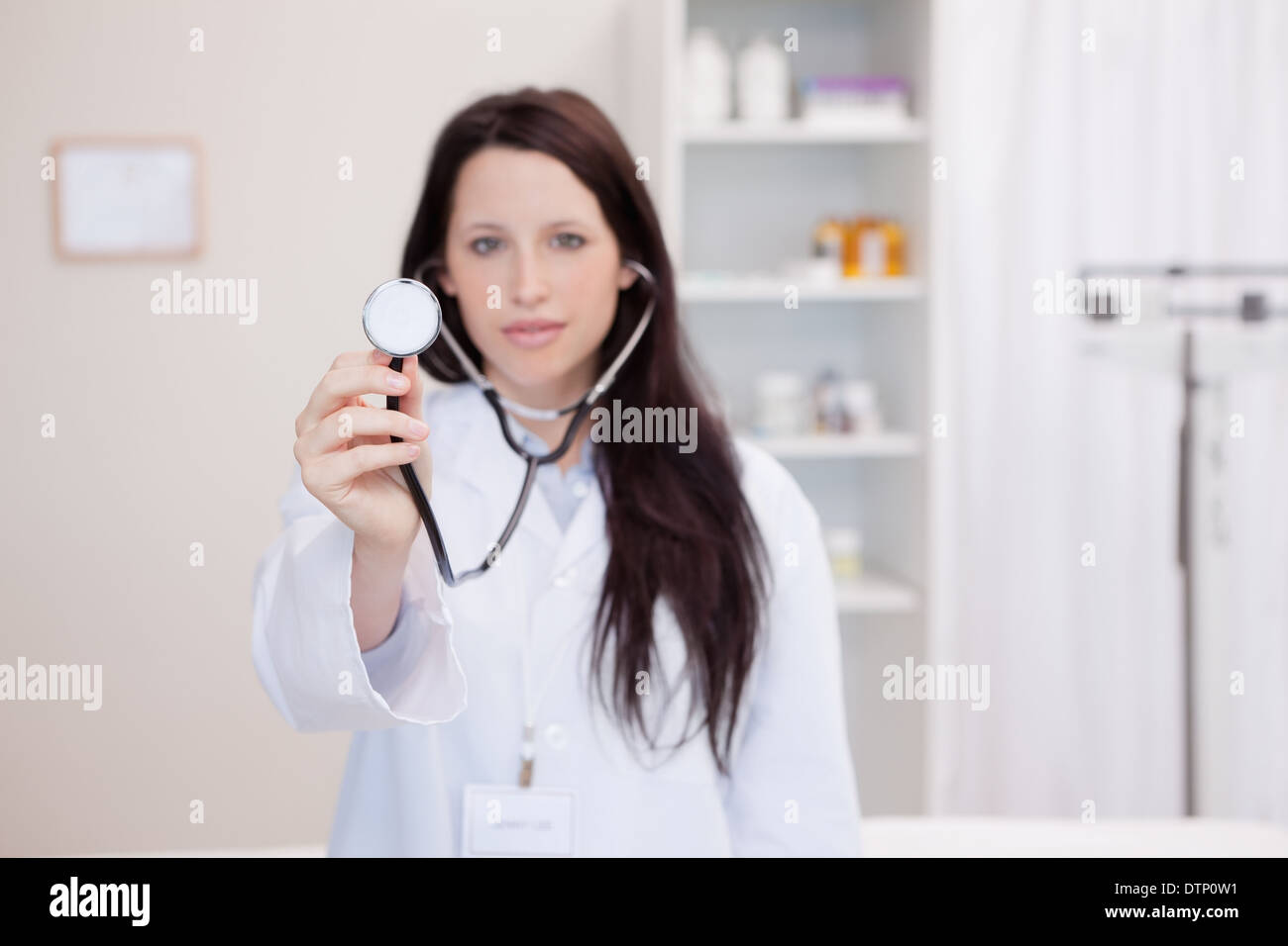 Female doctor using stethoscope Stock Photo - Alamy