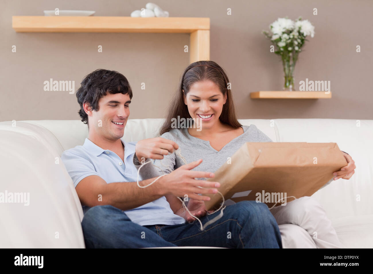 Opening parcel hi-res stock photography and images - Alamy