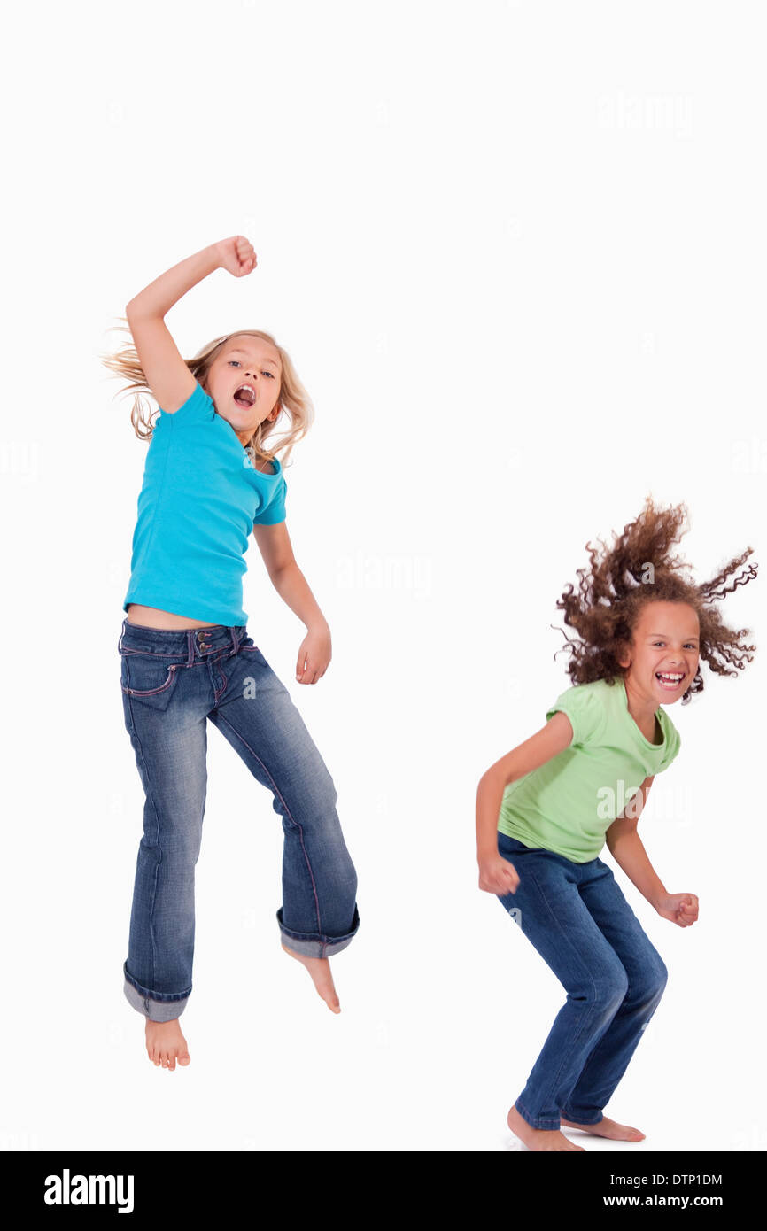Portrait of girls jumping Stock Photo - Alamy