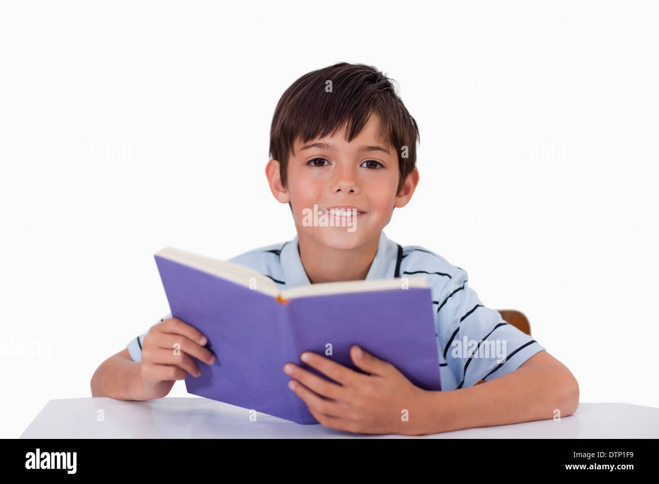 Happy boy reading a book Stock Photo - Alamy
