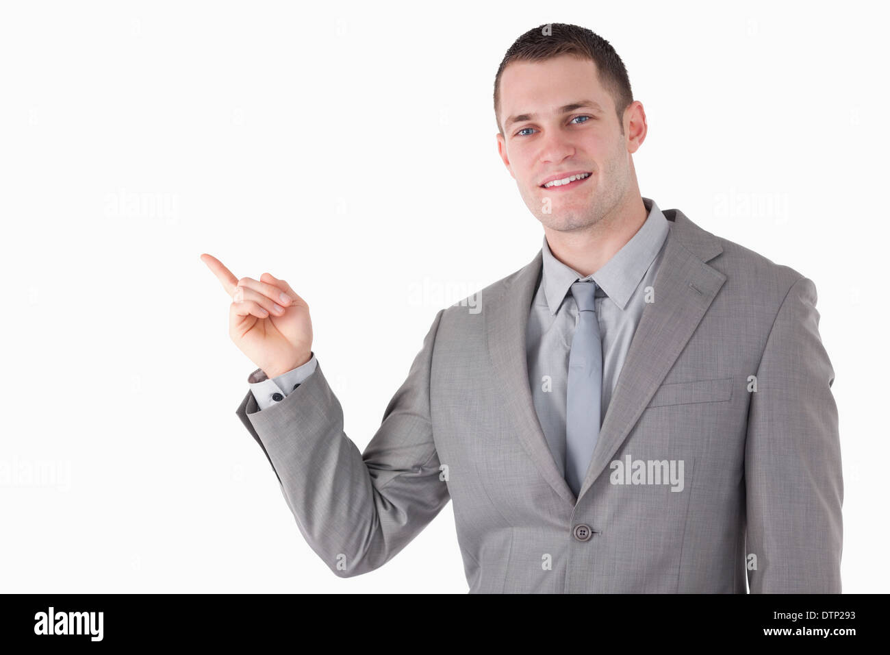 Young businessman pointing at something Stock Photo - Alamy