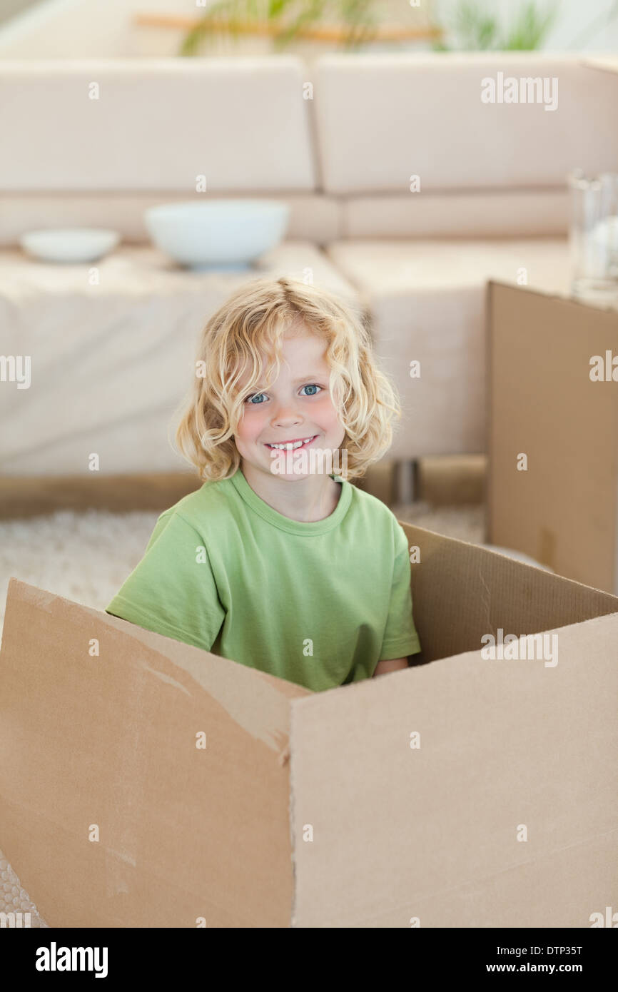 Boy hiding in cardboard box Stock Photo - Alamy