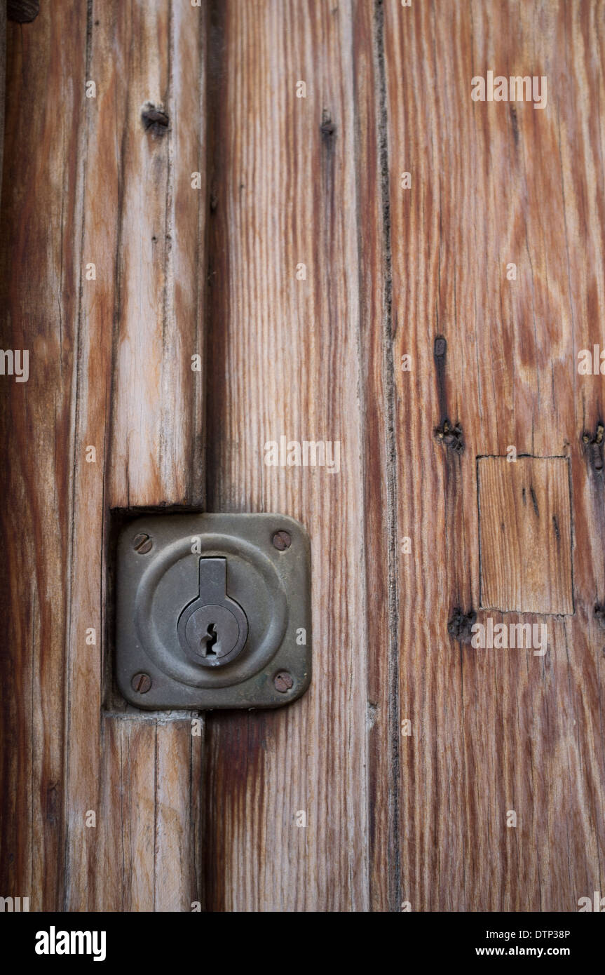 Old lock attached to an antique wooden door Stock Photo - Alamy