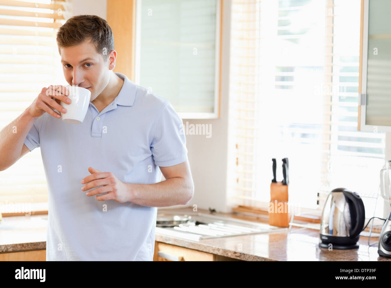 Young man holding sip hi-res stock photography and images - Alamy
