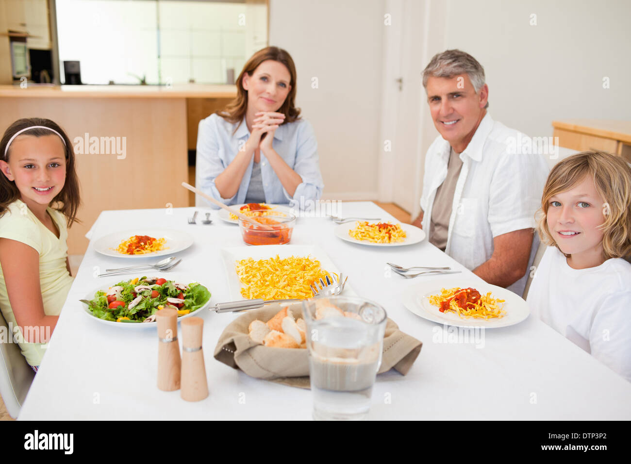 Family about to have dinner Stock Photo - Alamy