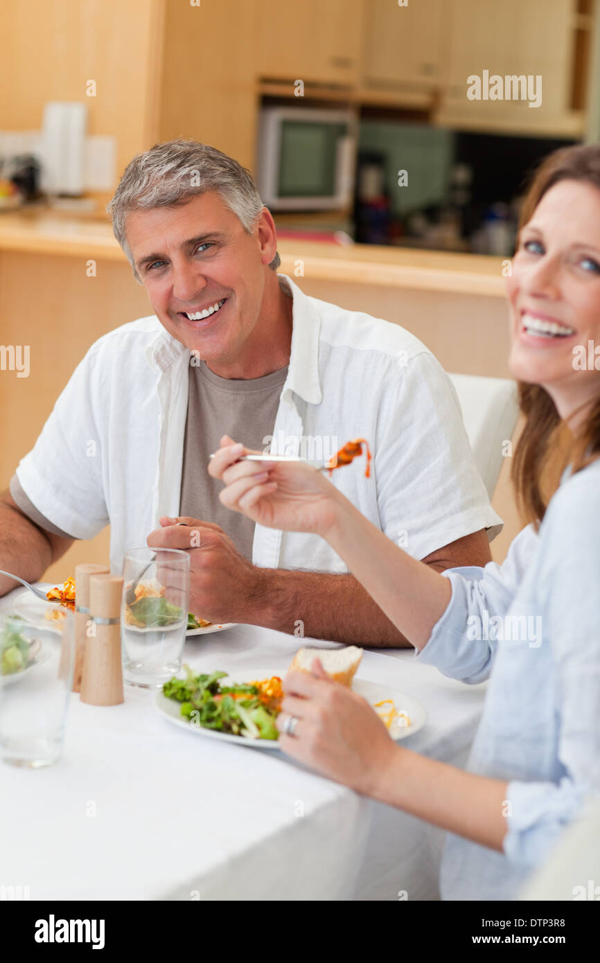 Happy couple eating their dinner Stock Photo - Alamy