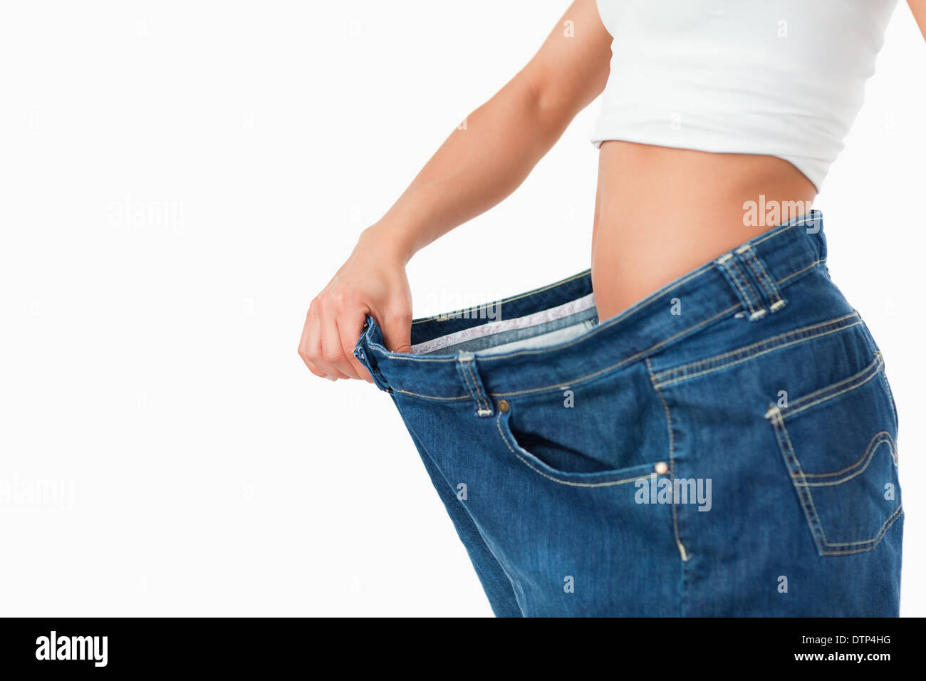 Woman wearing too large pants Stock Photo - Alamy