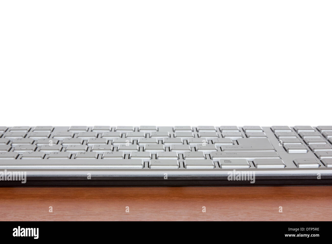 Silver computer keyboard on the wooden desk with copy-space for your ...