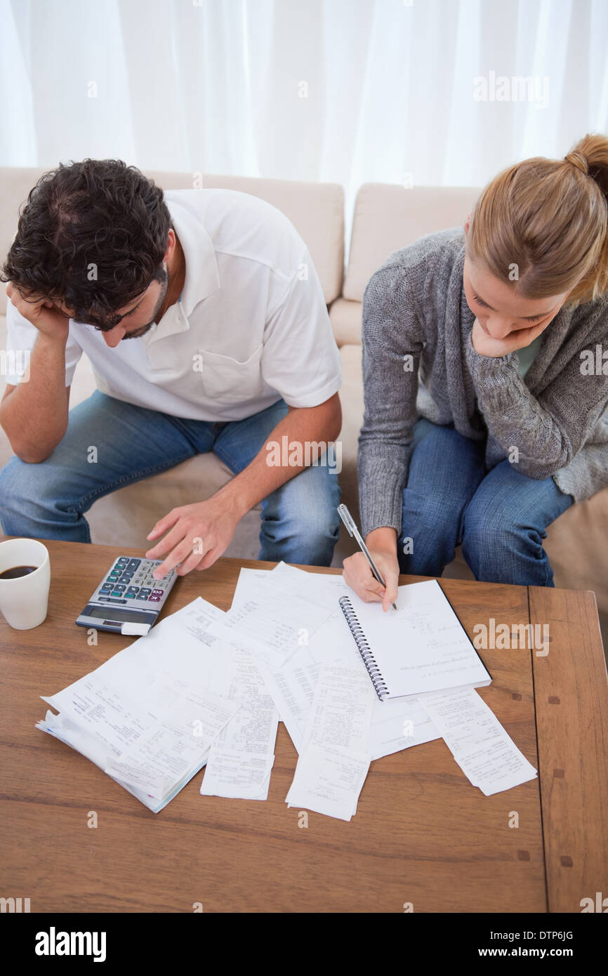 Portrait of a couple doing their accounting Stock Photo - Alamy