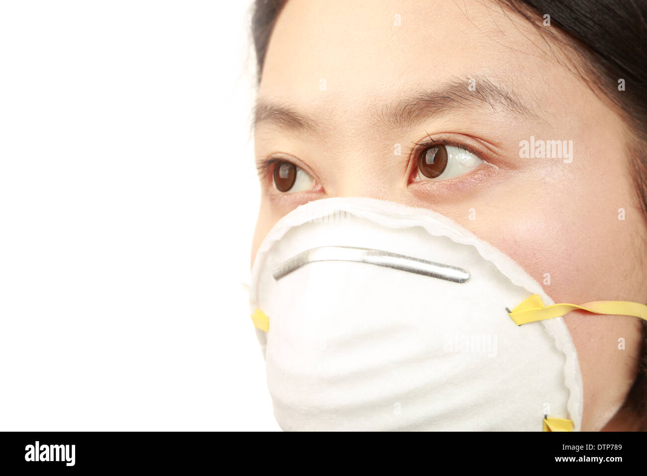 Asian woman wearing face mask on white background Stock Photo - Alamy