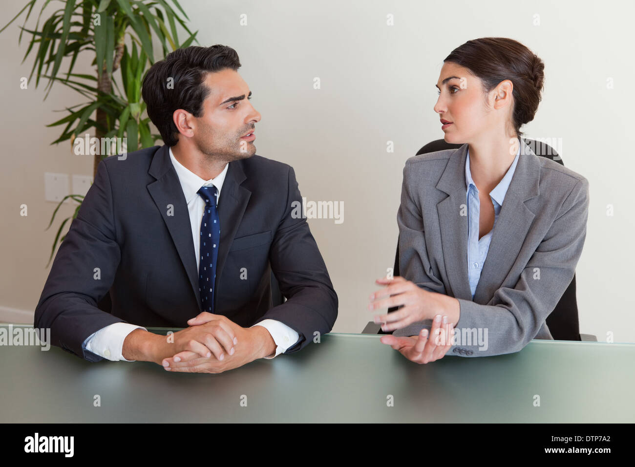 Serious business people negotiating Stock Photo - Alamy