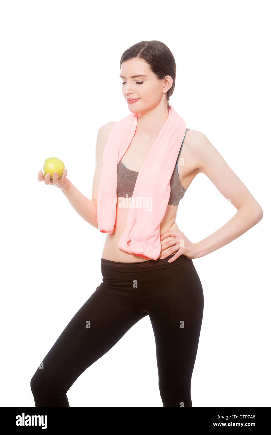 Fitness model with apple Stock Photo - Alamy