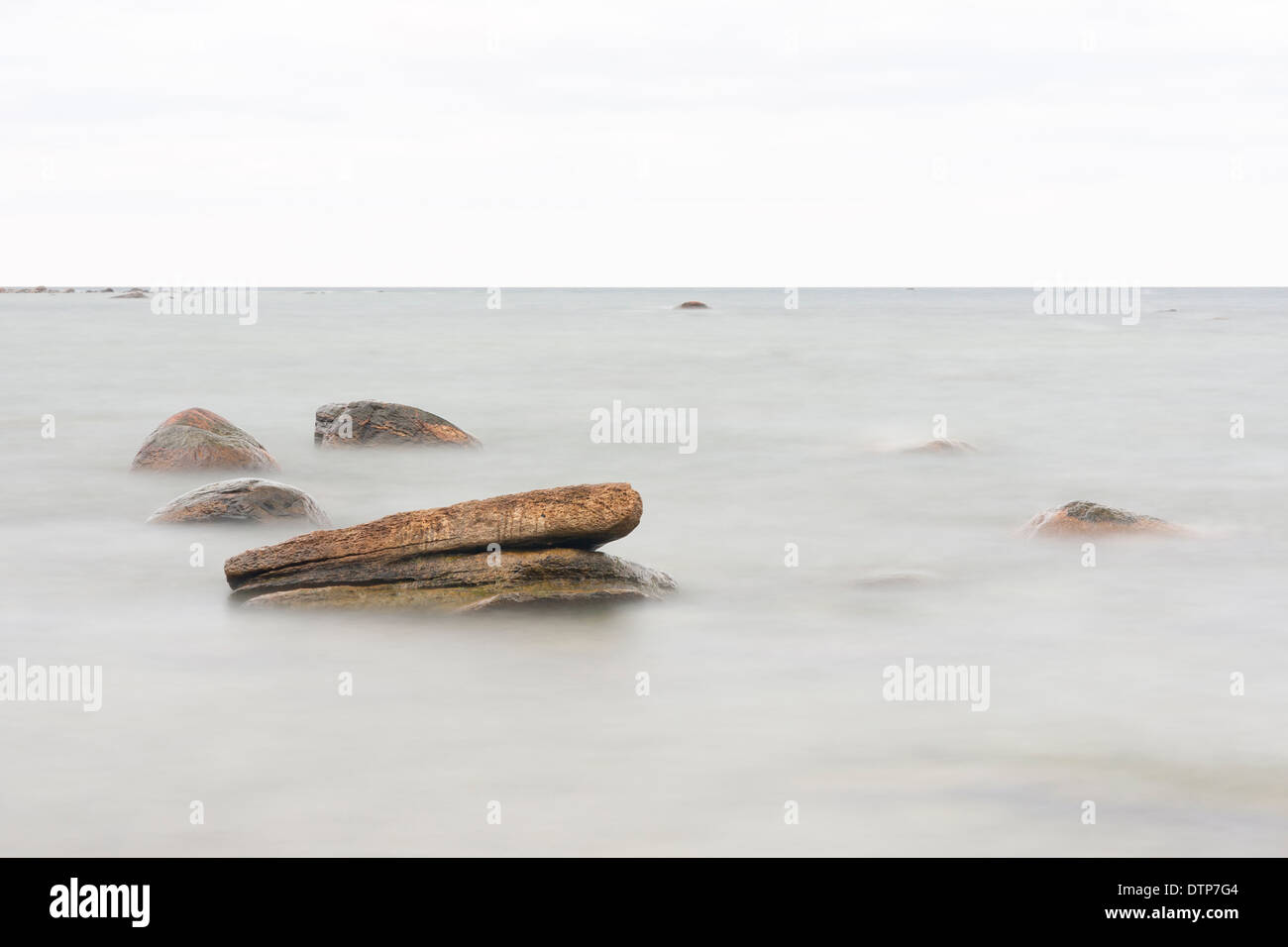 Rock in calm sea hi-res stock photography and images - Alamy