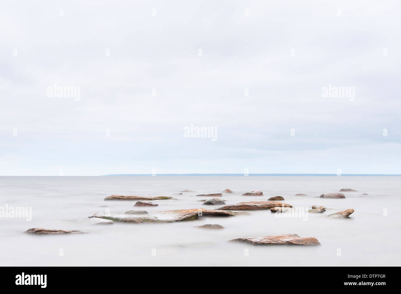 Rock in calm sea hi-res stock photography and images - Alamy