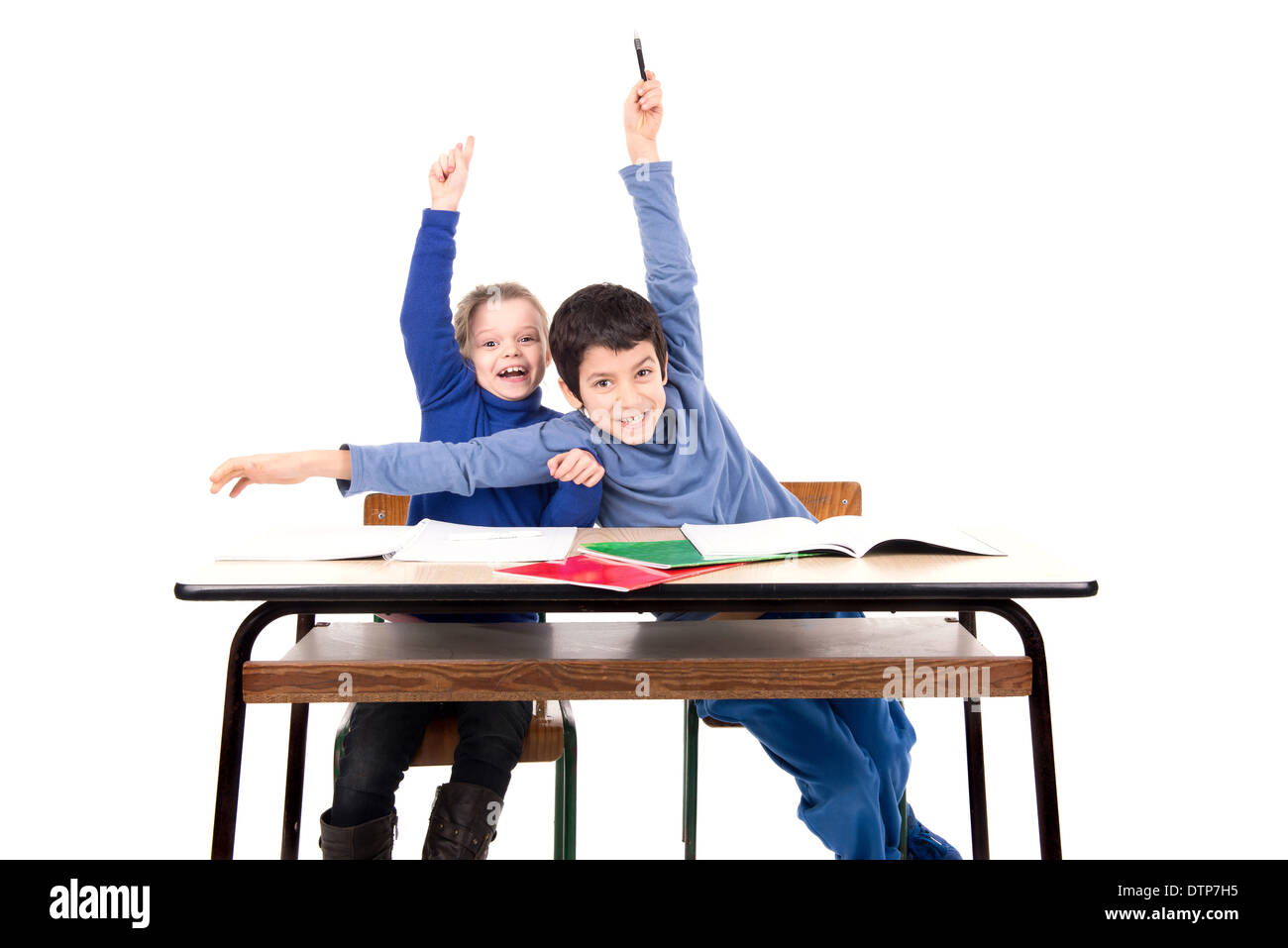 Children in the classroom raising their hands Stock Photo - Alamy