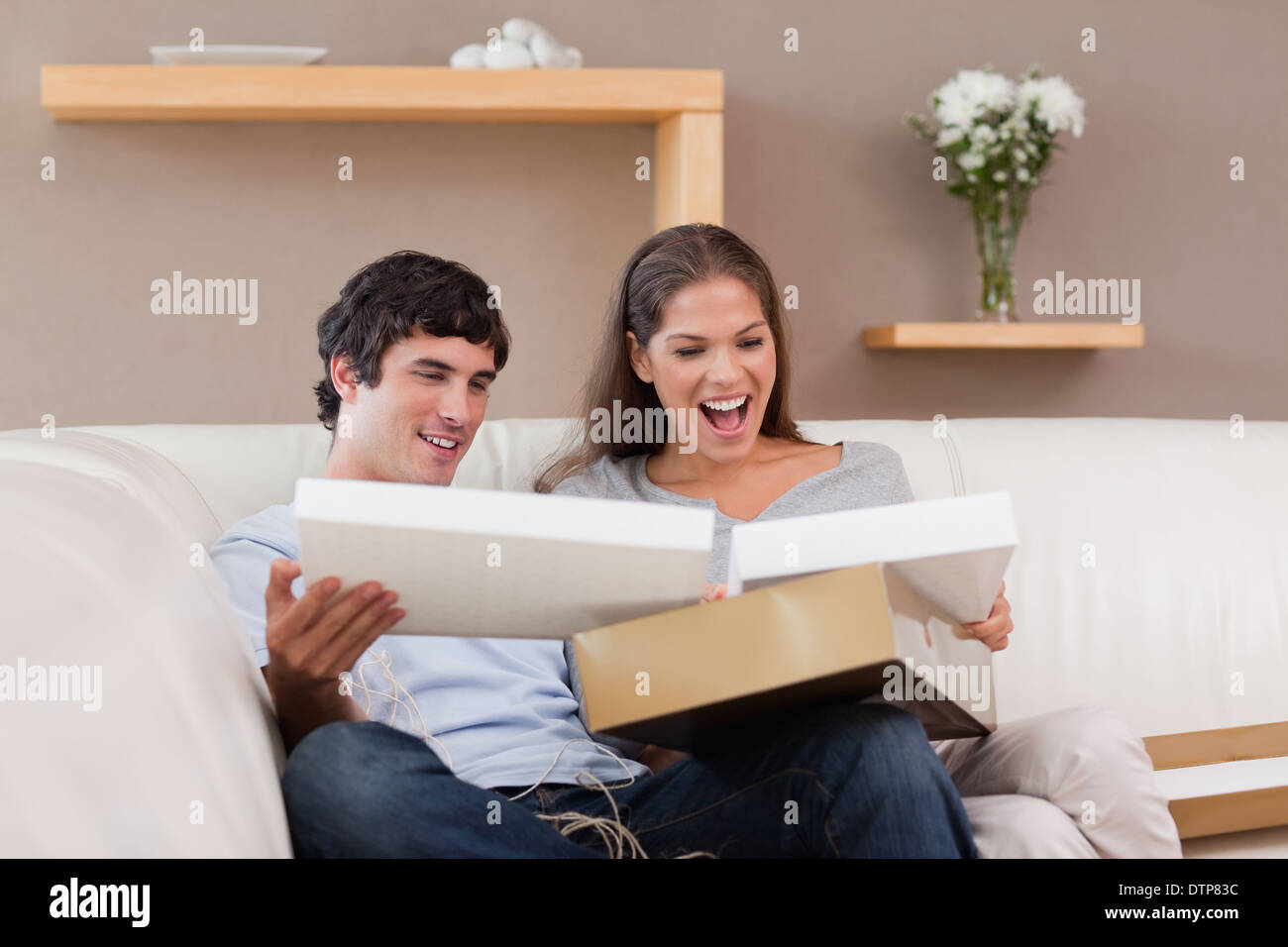 Opening parcel hi-res stock photography and images - Alamy
