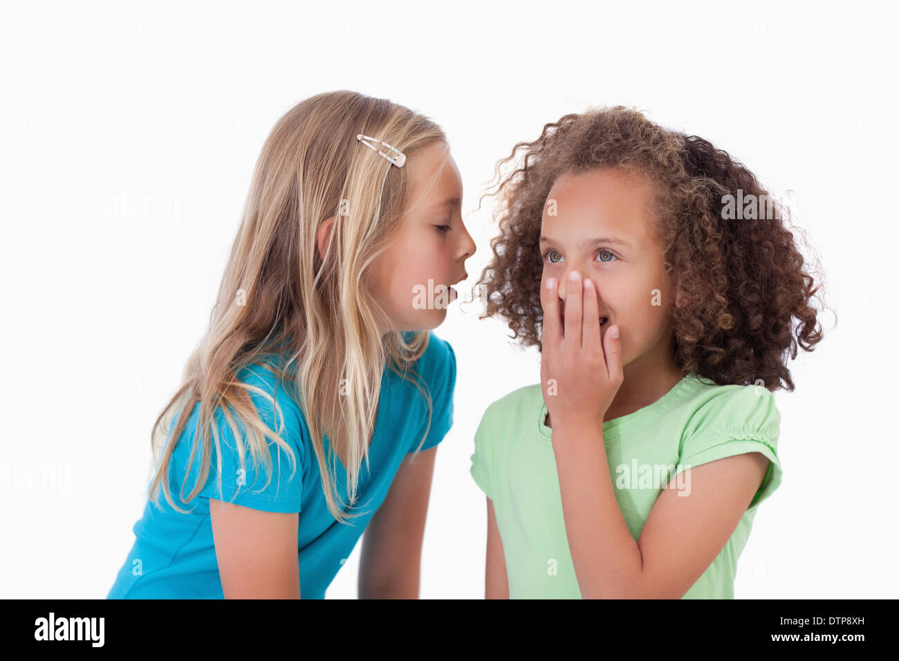 Girl whispering friend hi-res stock photography and images - Alamy