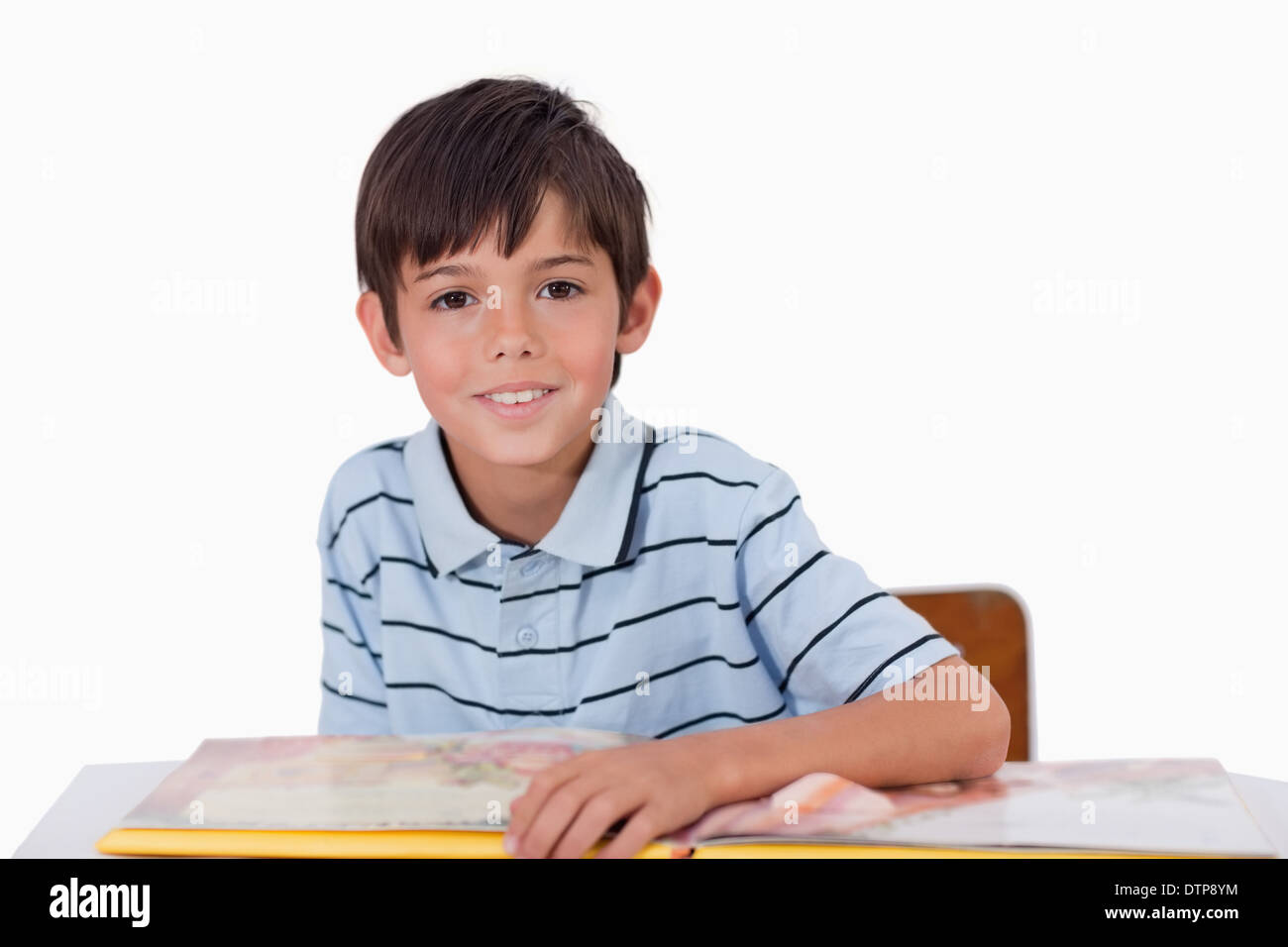 Cute boy reading a book Stock Photo - Alamy
