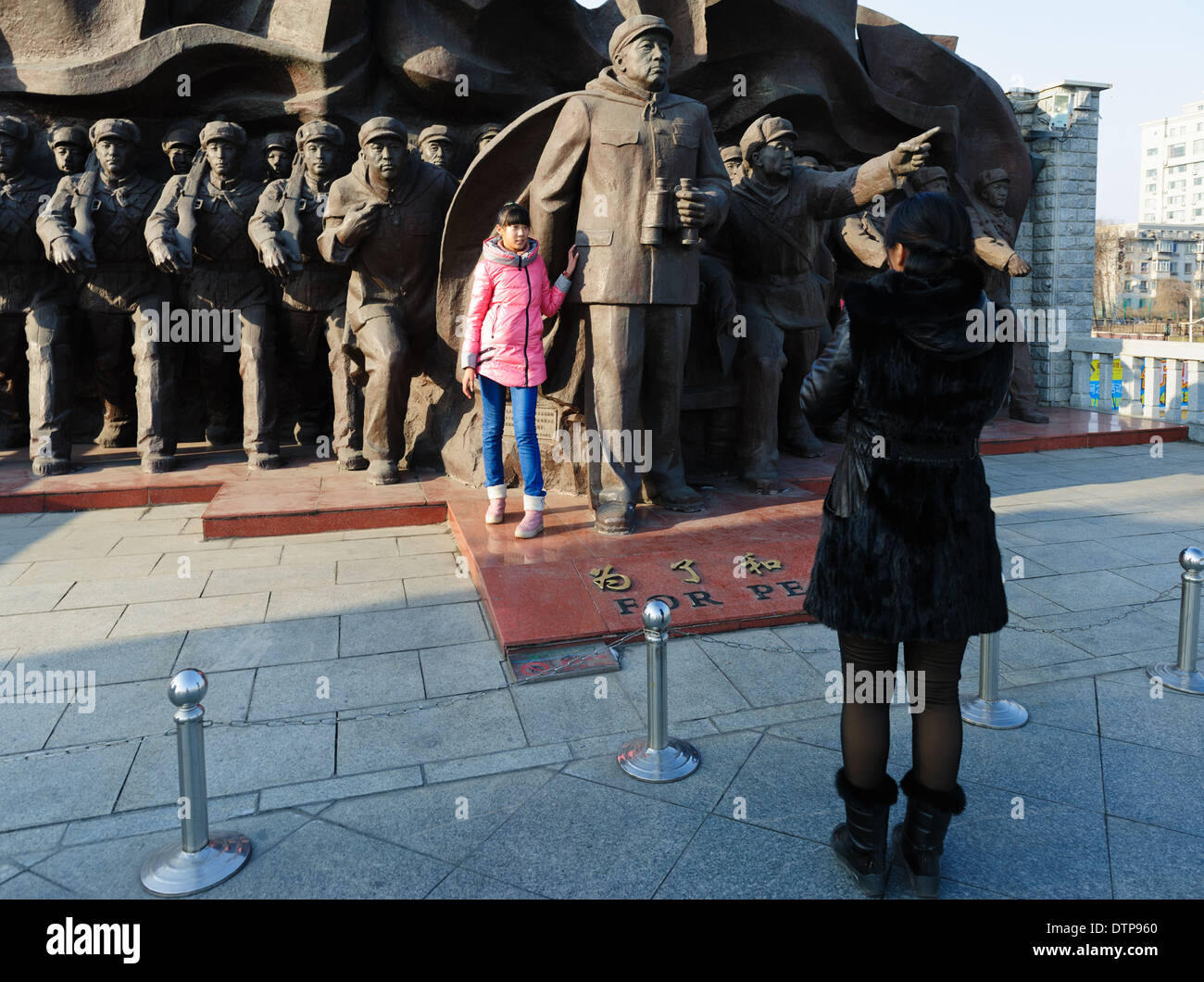 Taking pictures in front of heroic sculpture at beginning of the Sino ...