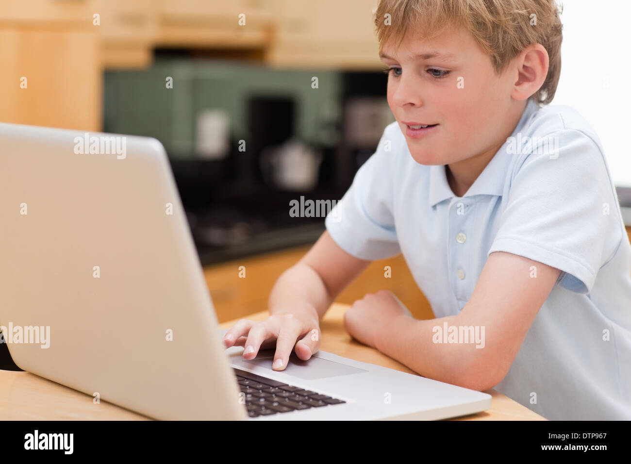 Boy using computer hi-res stock photography and images - Alamy