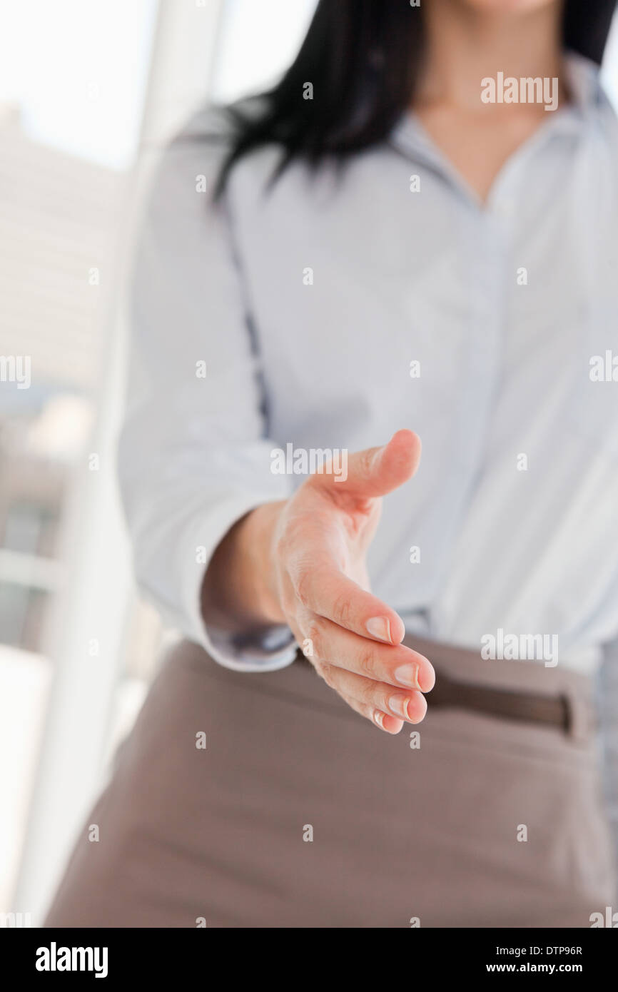 A woman with her hand outstretched Stock Photo - Alamy