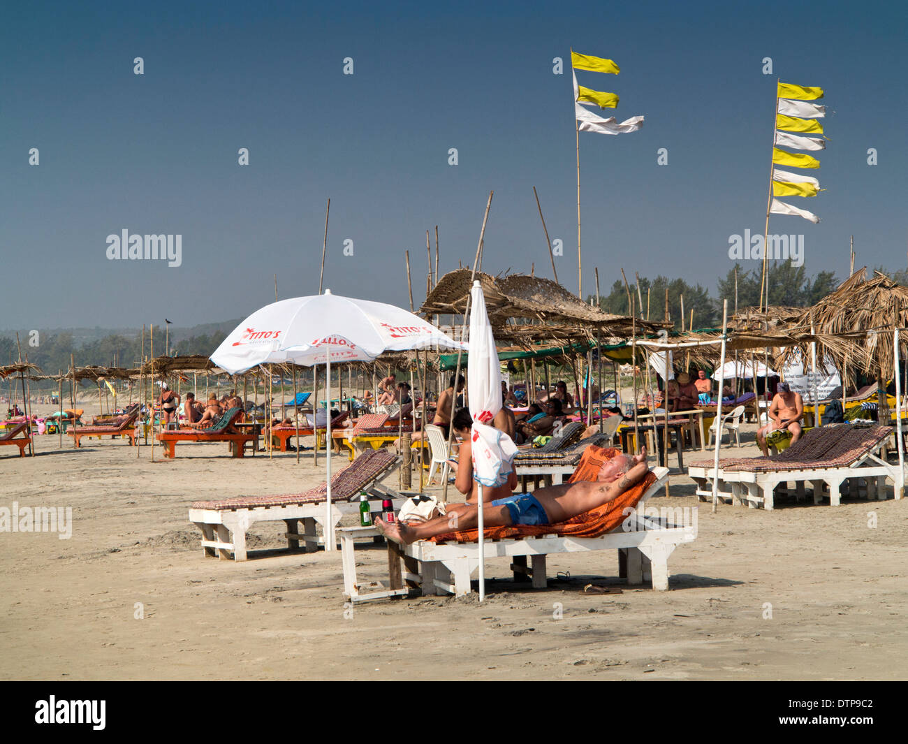 India, Goa, Morjim, tourists sunbathing on loungers Stock Photo - Alamy