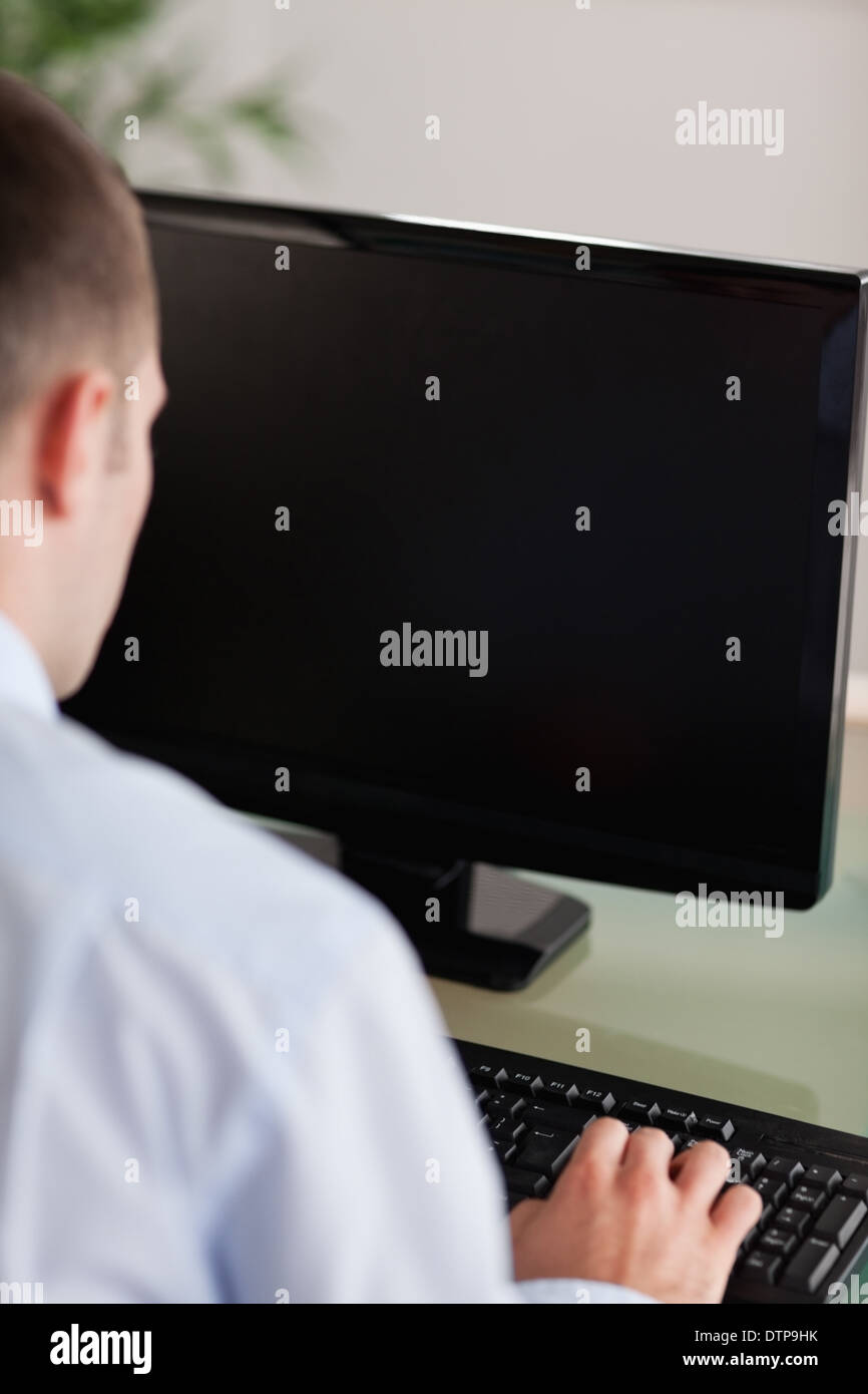 Close up of businessmans back typing Stock Photo - Alamy