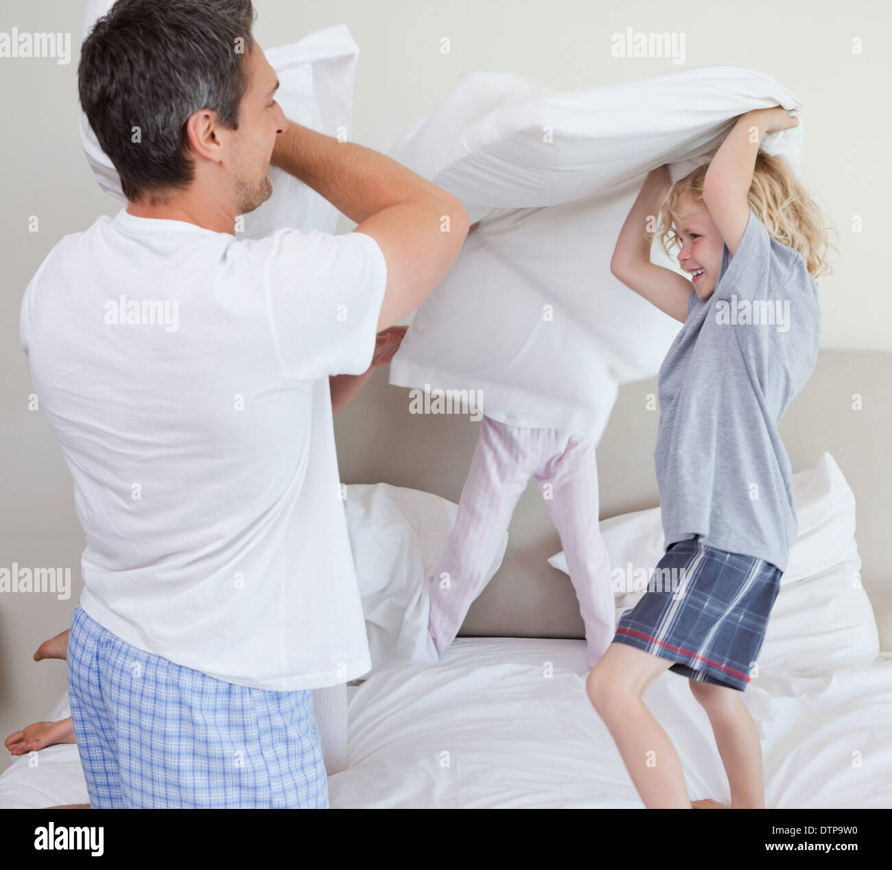 Boy girl playing pillow fight hi-res stock photography and images - Alamy