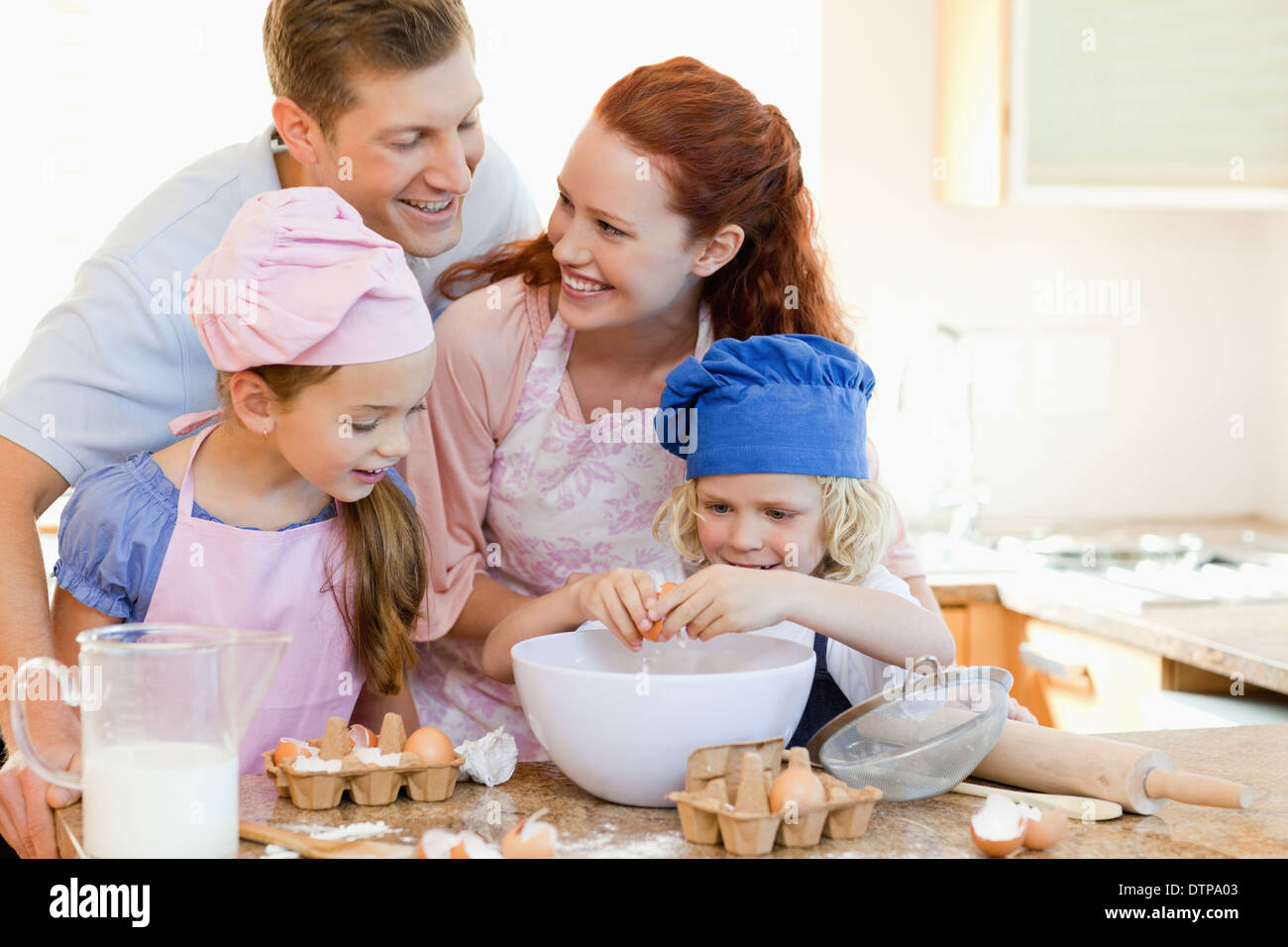 Happy family enjoys baking together Stock Photo - Alamy