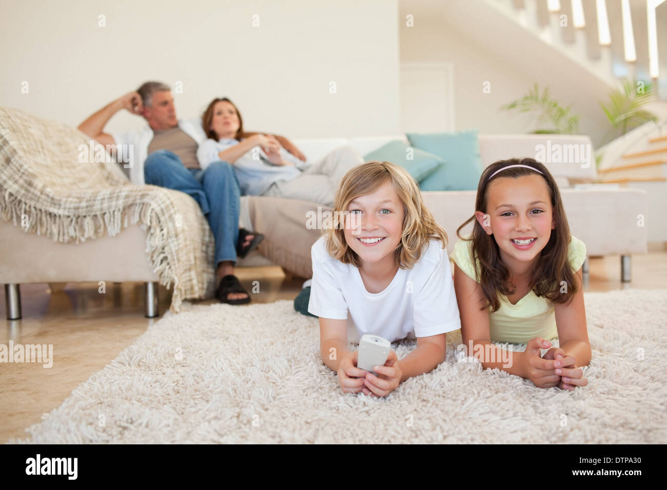 Siblings sitting on floor together hi-res stock photography and images ...