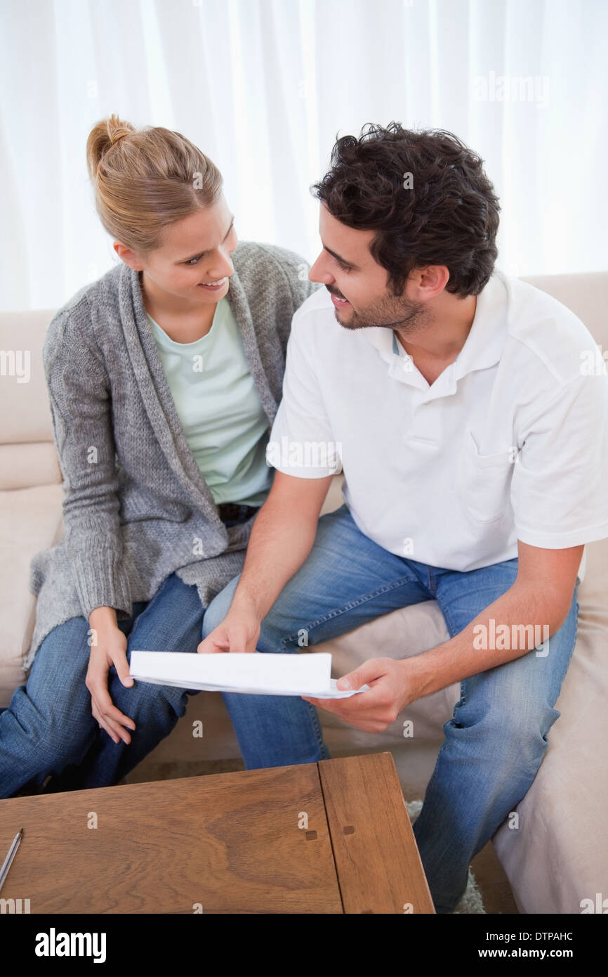 Portrait of a young couple reading a letter Stock Photo - Alamy
