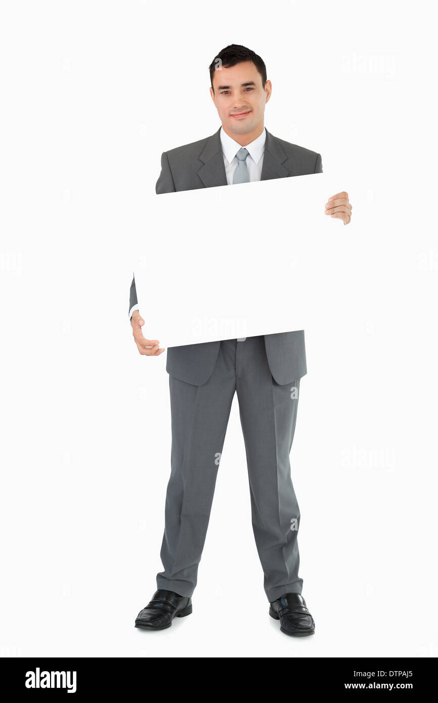 Businessman holding sign Stock Photo - Alamy