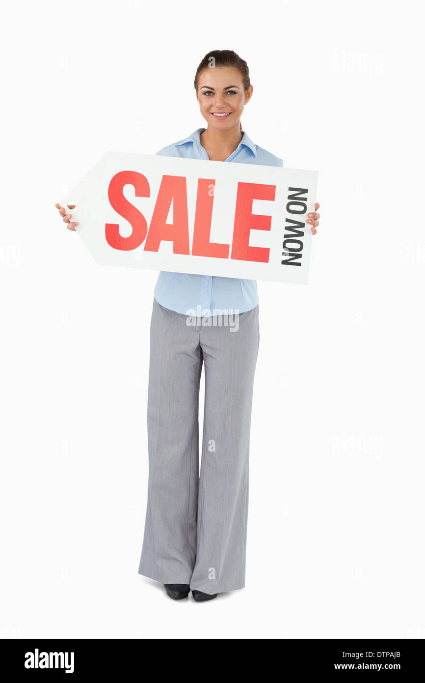 Businesswoman holding sign Stock Photo - Alamy