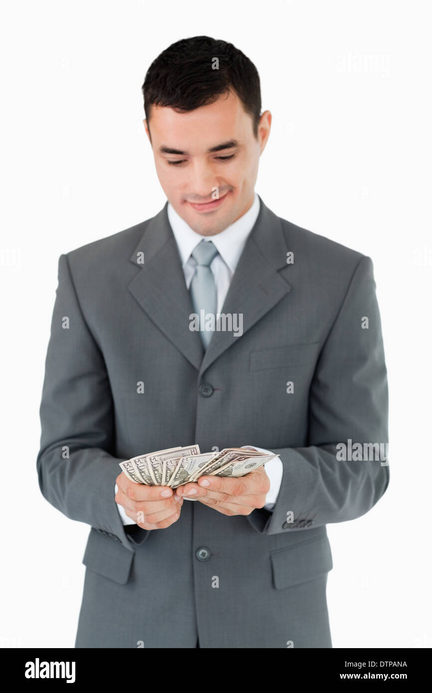 Businessman counting bank notes Stock Photo - Alamy