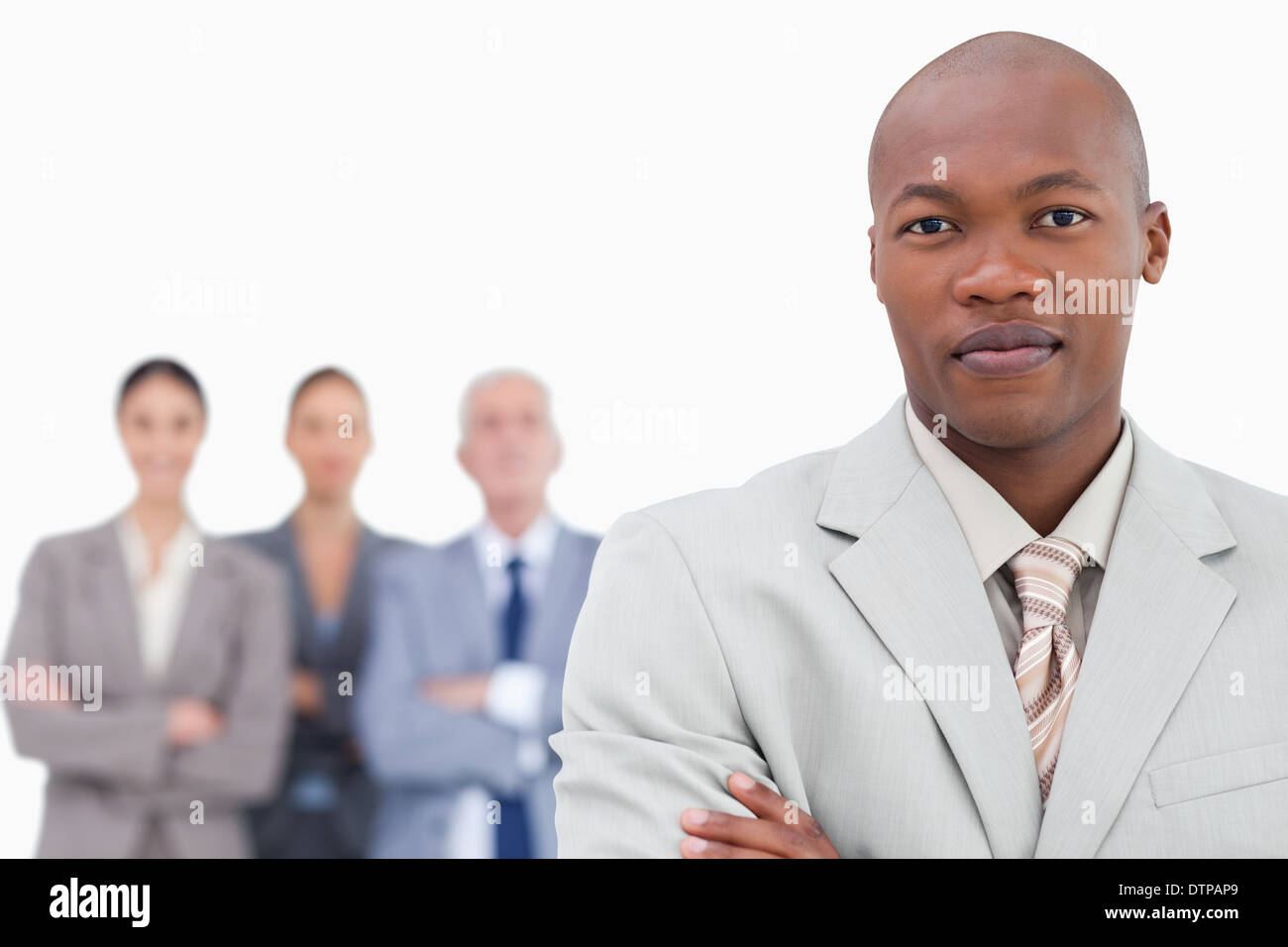 Tradesman with team behind him Stock Photo - Alamy