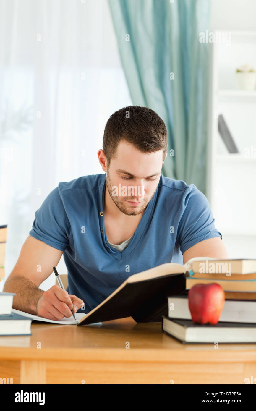 Student working through subject materials Stock Photo - Alamy