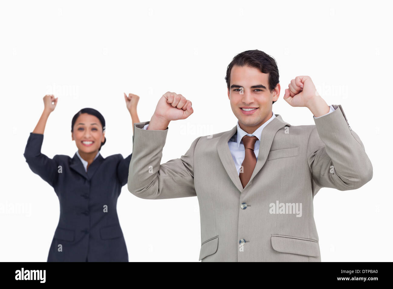 Cheering salesman with colleague behind him Stock Photo - Alamy