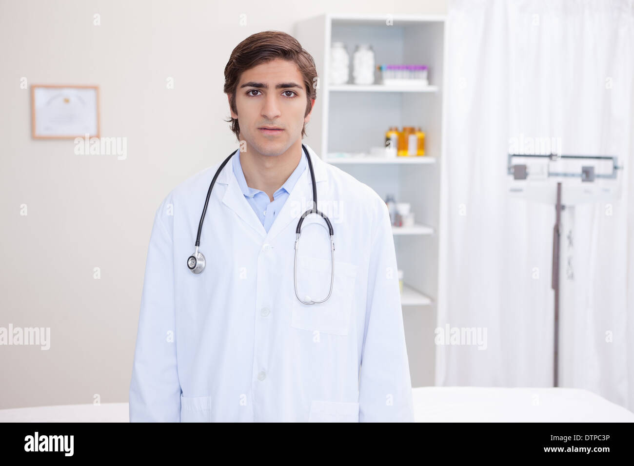 Male doctor standing Stock Photo - Alamy