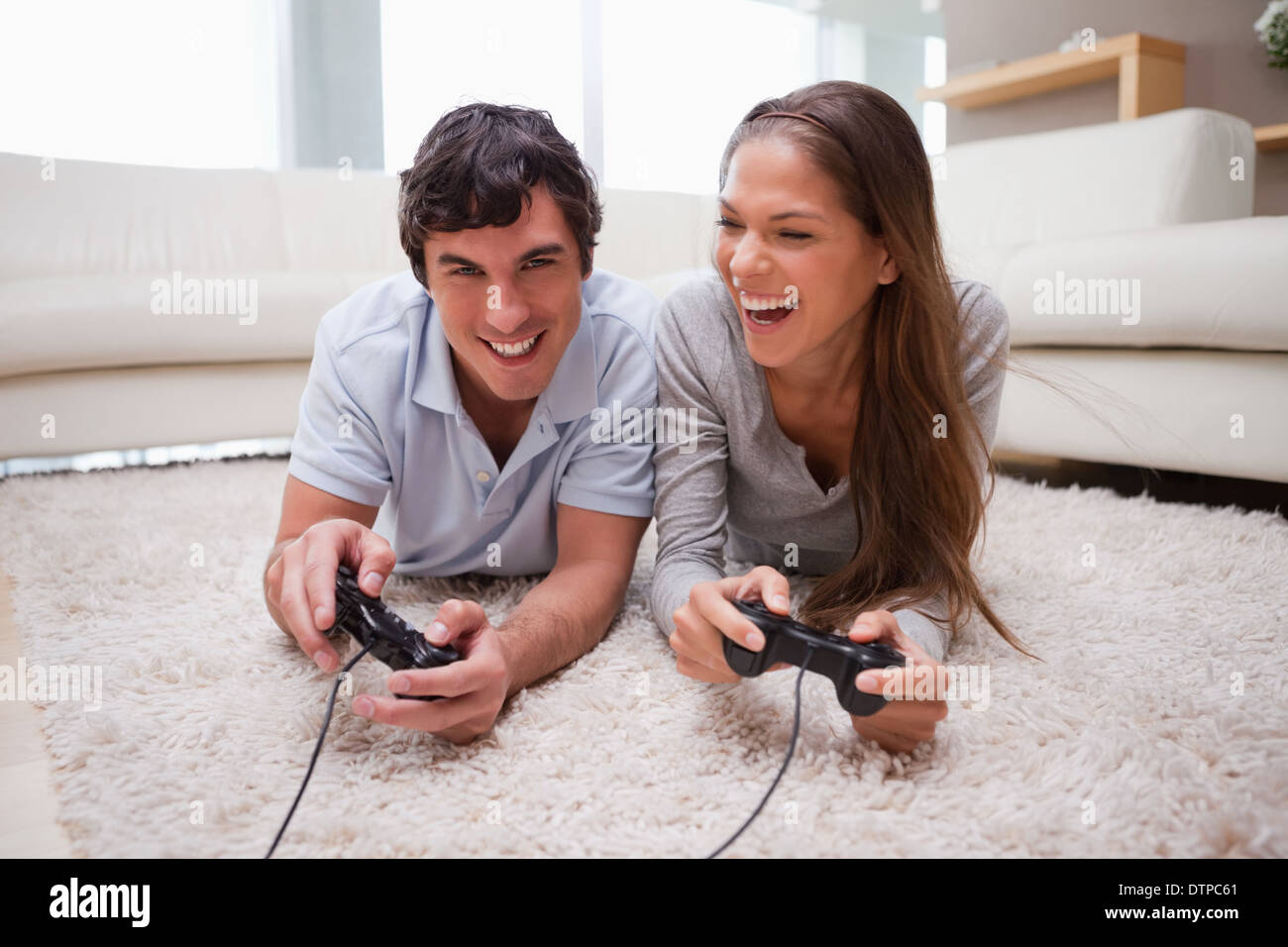 Couple playing video games together Stock Photo - Alamy
