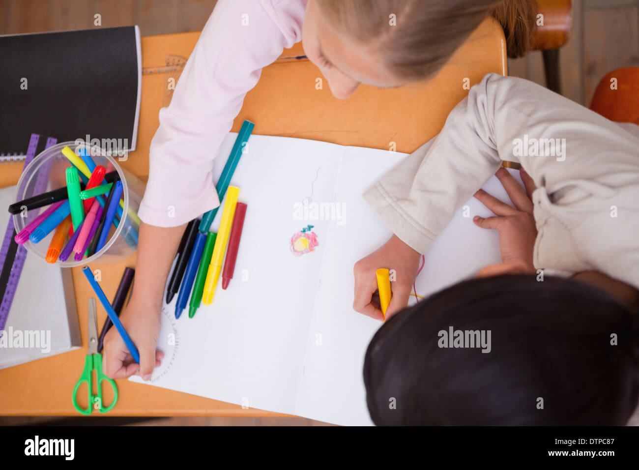 Above view of schoolgirls drawing Stock Photo - Alamy