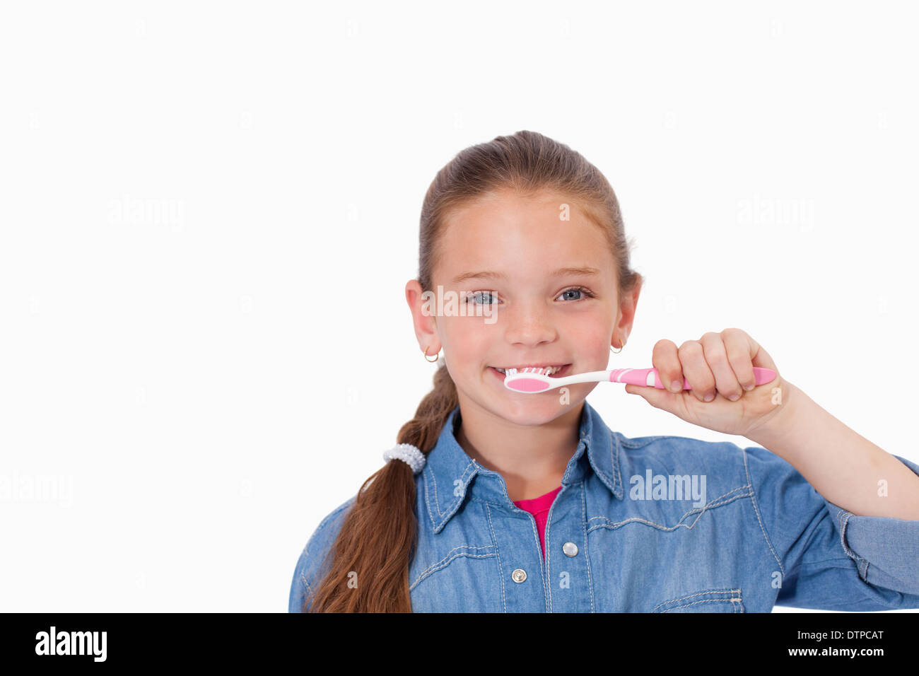 Healthy girl brushing her teeth Stock Photo - Alamy