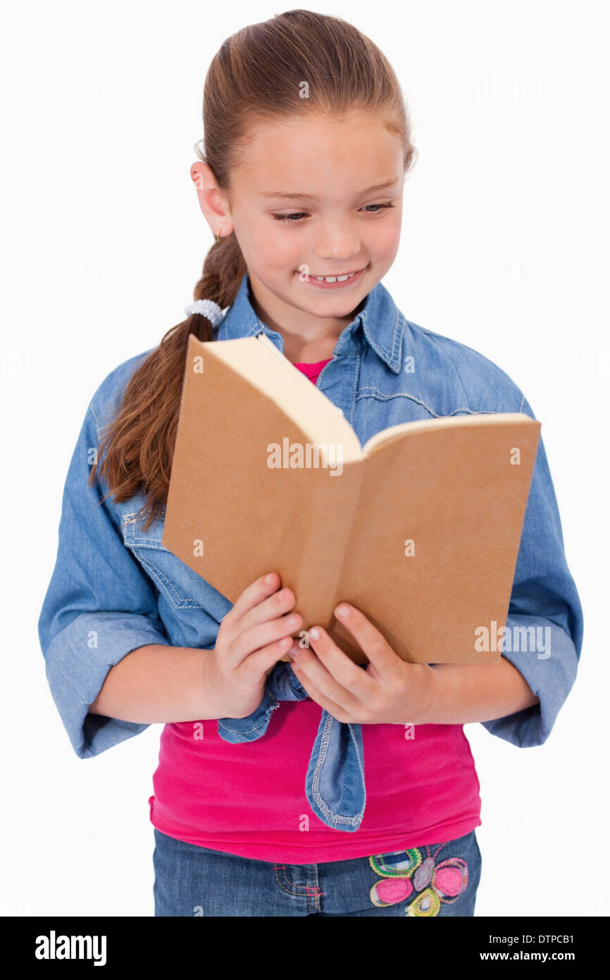 Portrait of a calm girl reading a book Stock Photo - Alamy