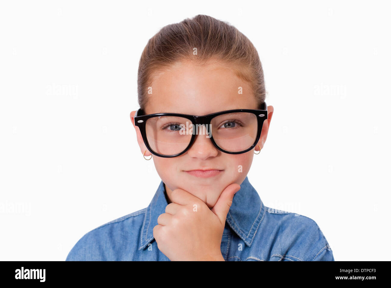 Girl thinking with her hand on her chin Stock Photo - Alamy