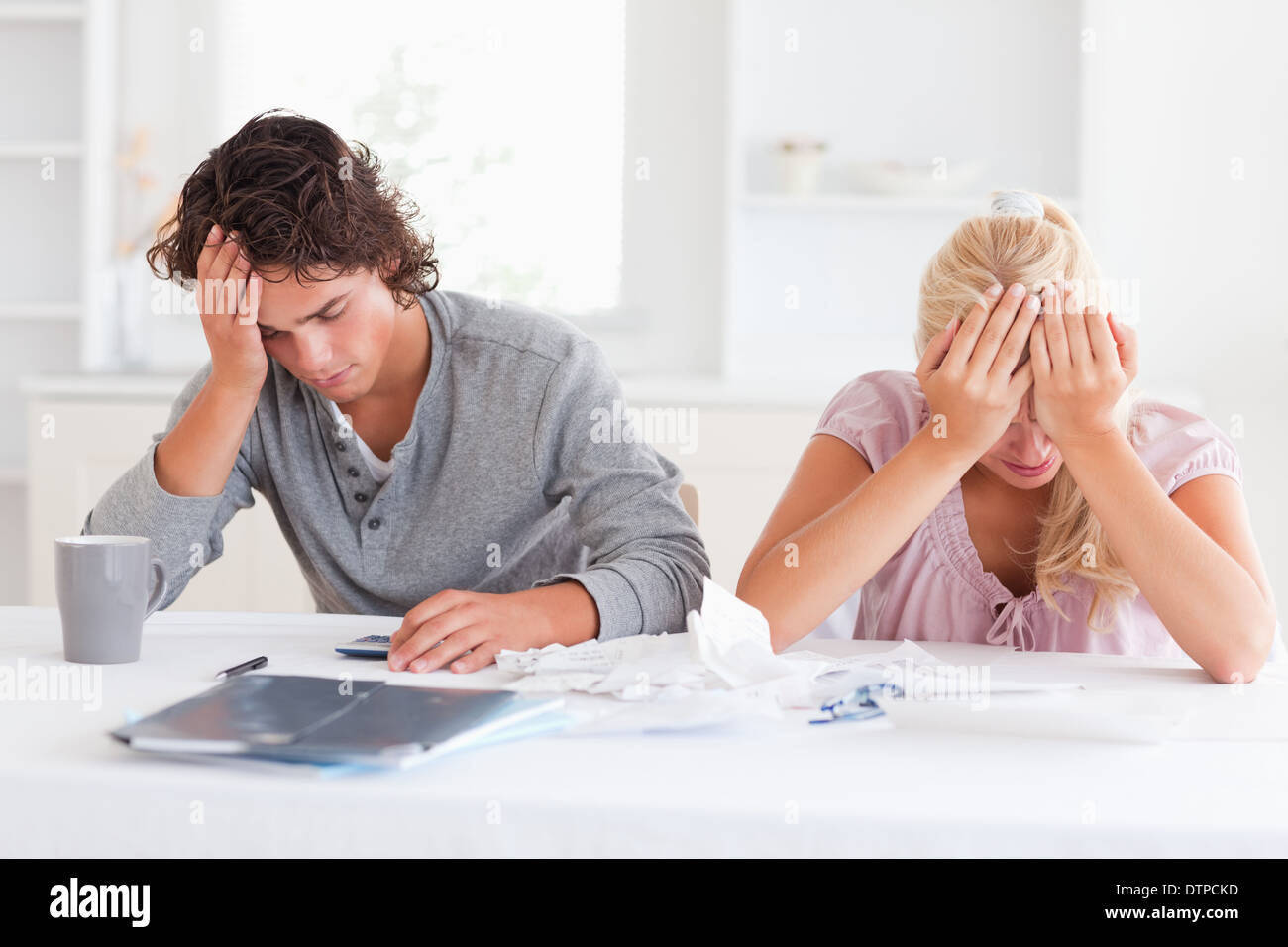 Sad couple while accounting Stock Photo - Alamy
