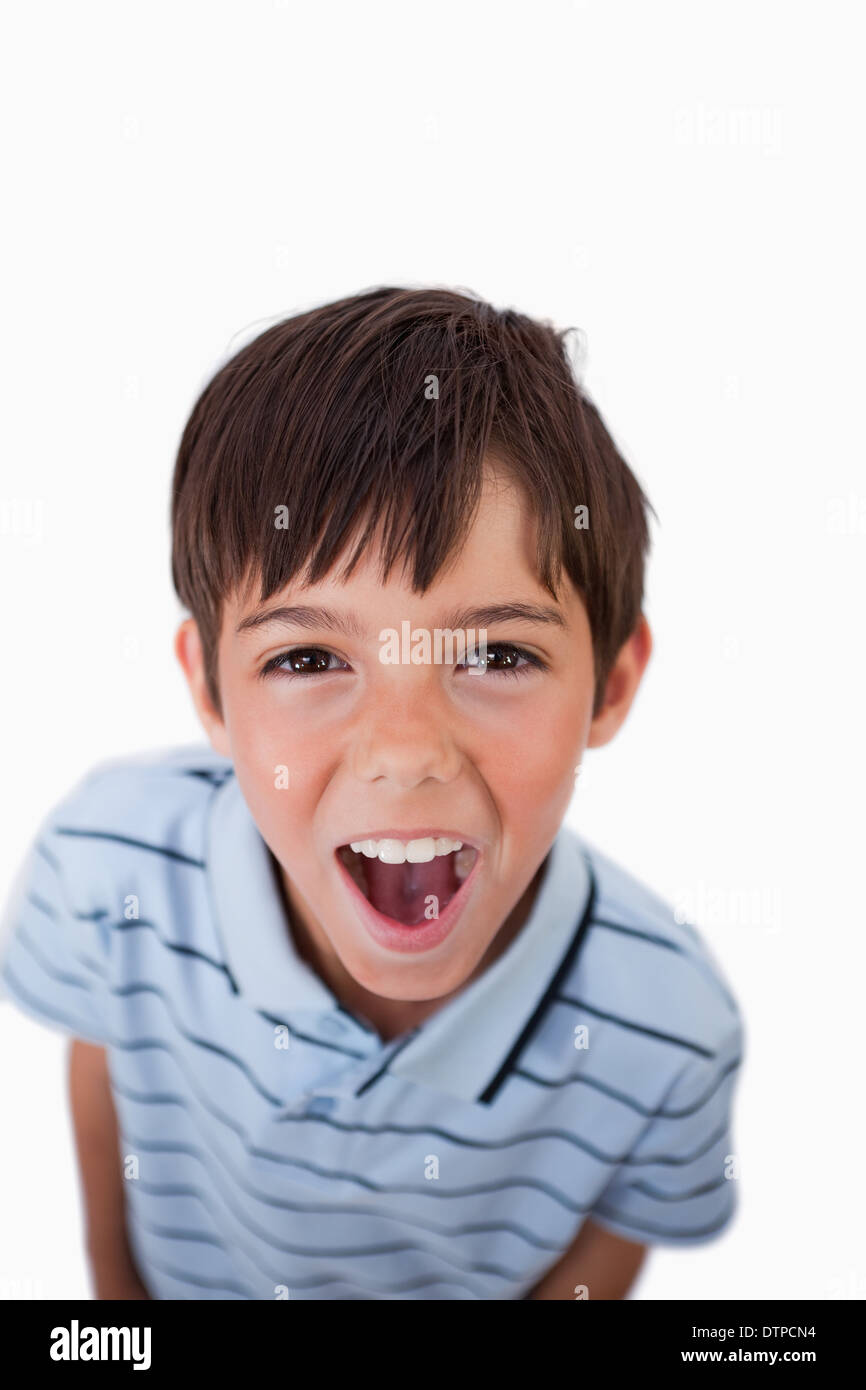 Portrait of a boy screaming at the viewer Stock Photo - Alamy