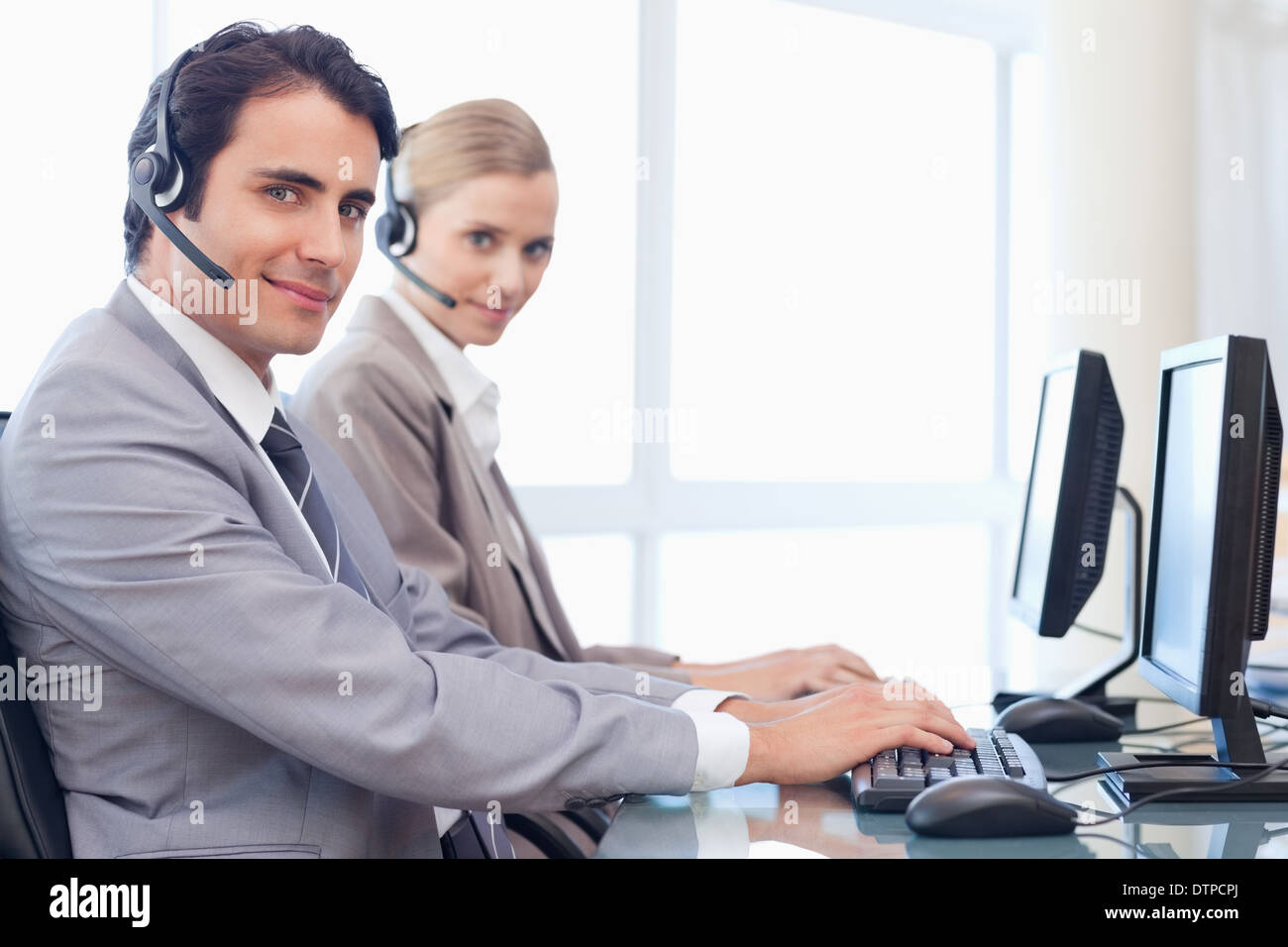 Operators using a monitor Stock Photo - Alamy