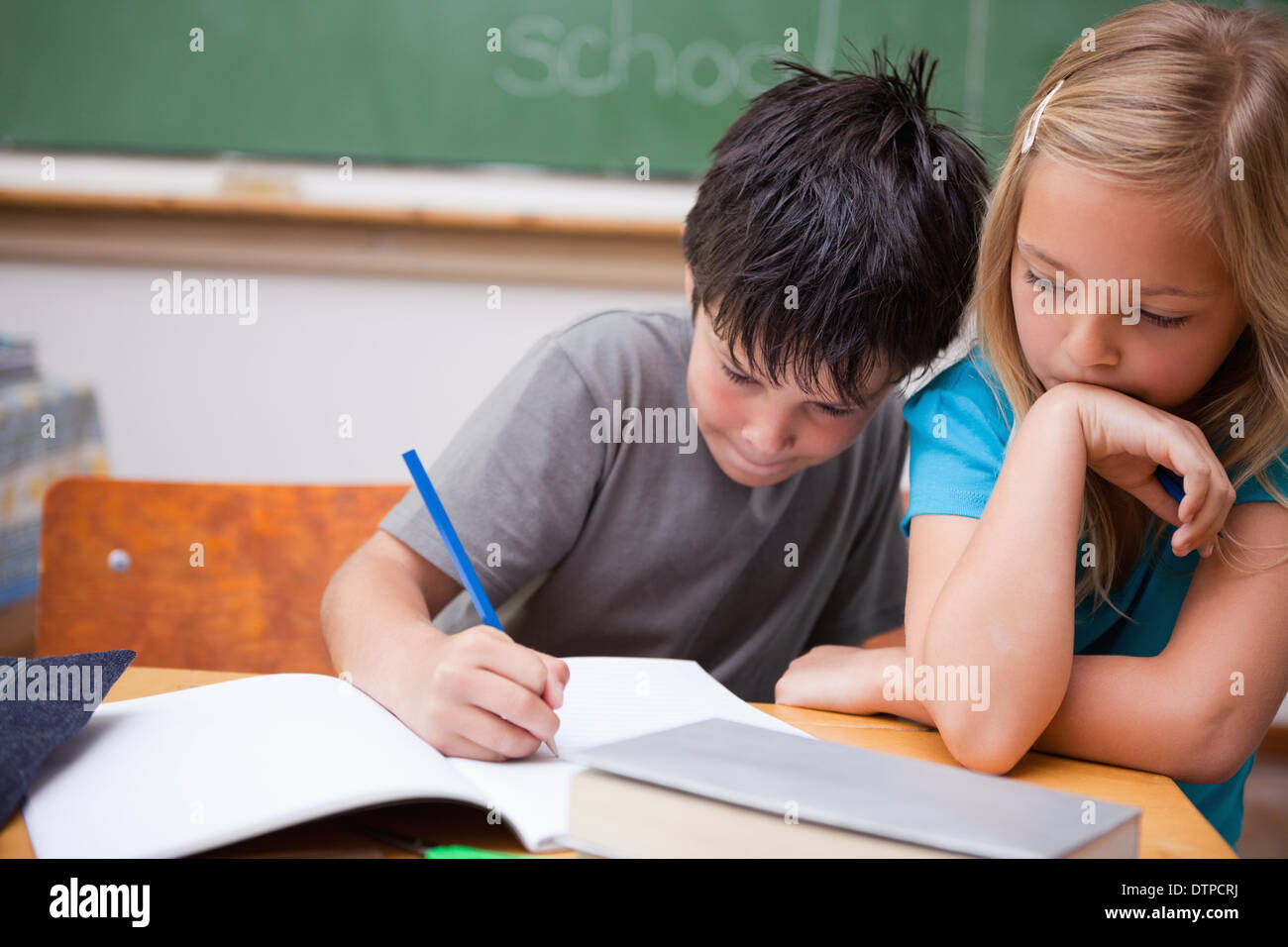 Serious pupils working together Stock Photo - Alamy Serious pupils working together Stock Photo - Alamy