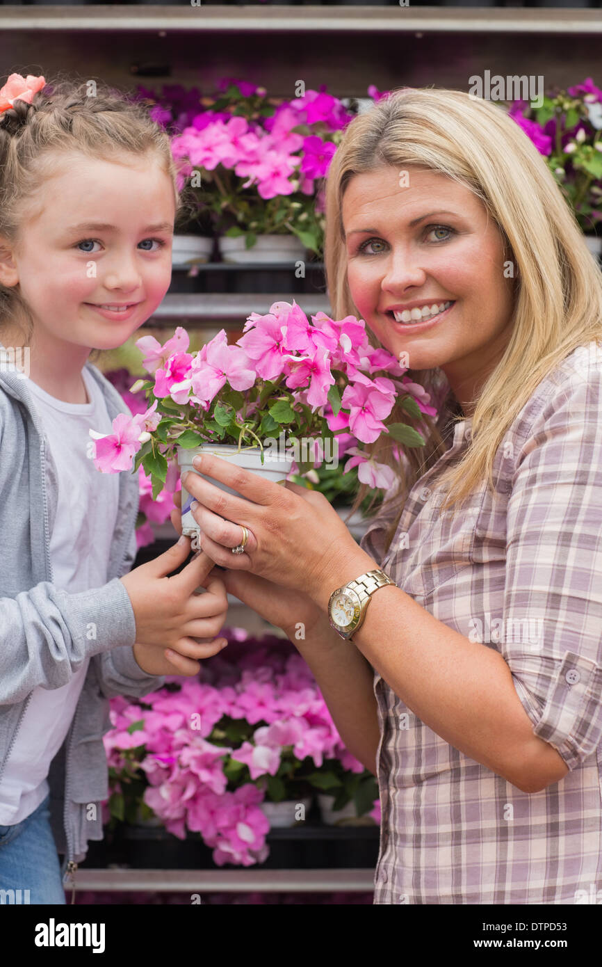 Mother and child holding a flower Stock Photo - Alamy