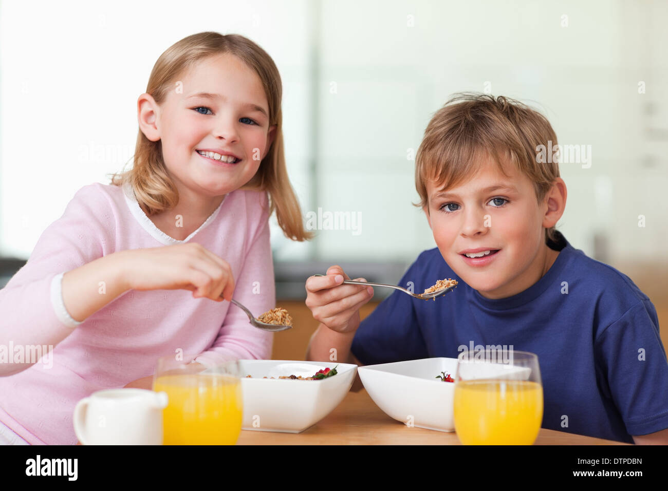 Children having breakfast Stock Photo - Alamy