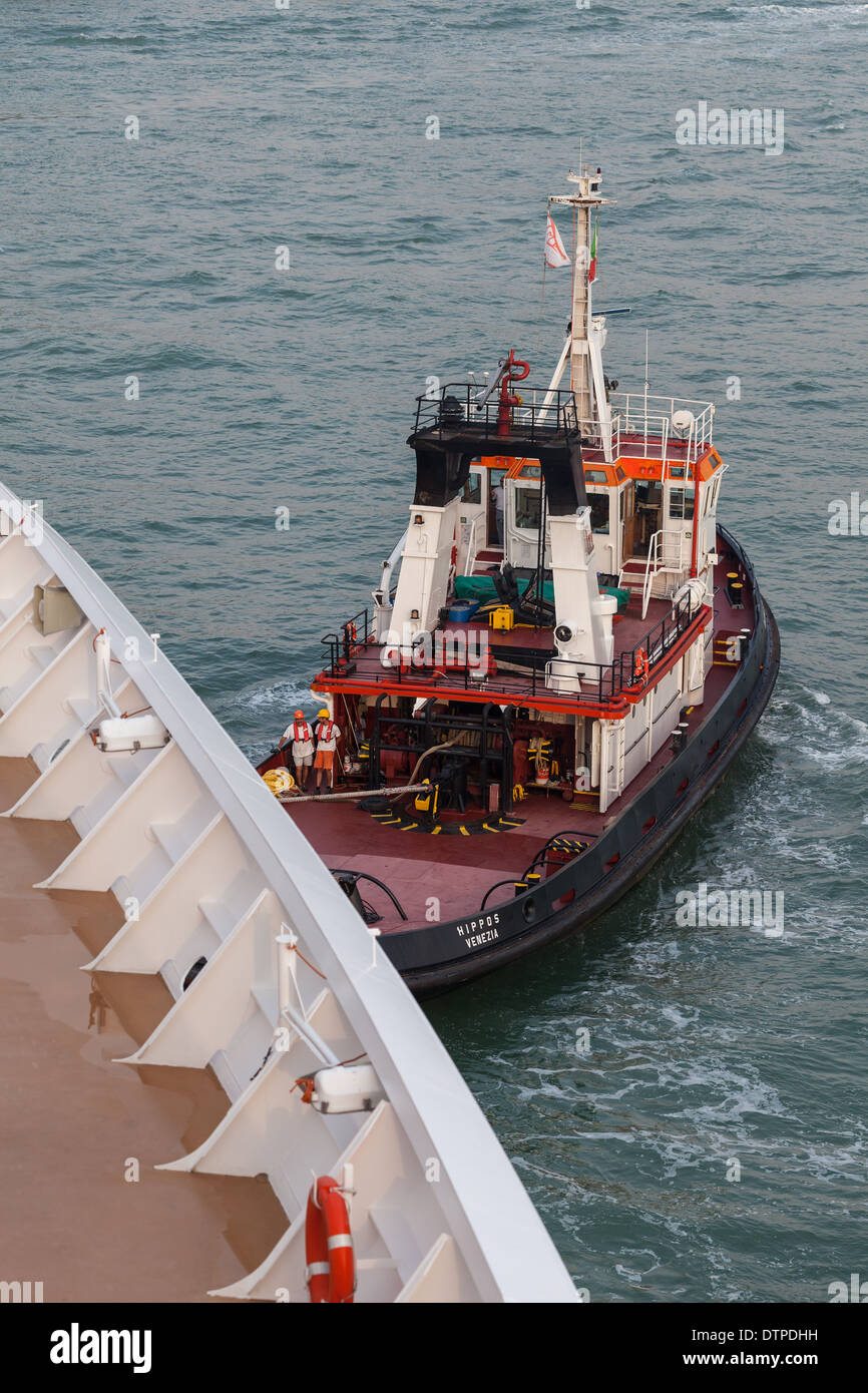 Tug pulling large Passenger ship. Venice waterways.Italy Stock Photo ...